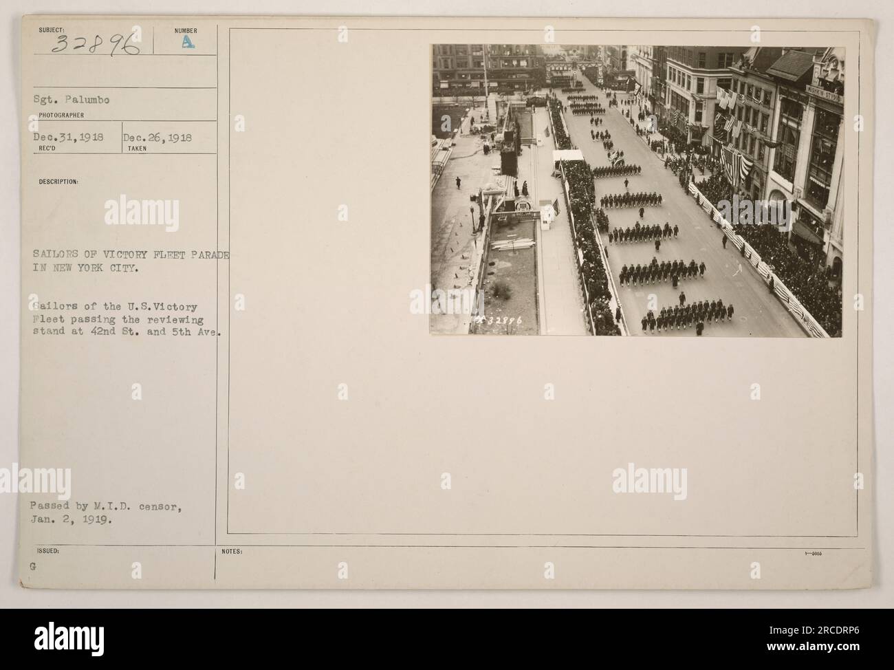 "The photograph shows a parade of sailors from the U.S. Victory Fleet ...