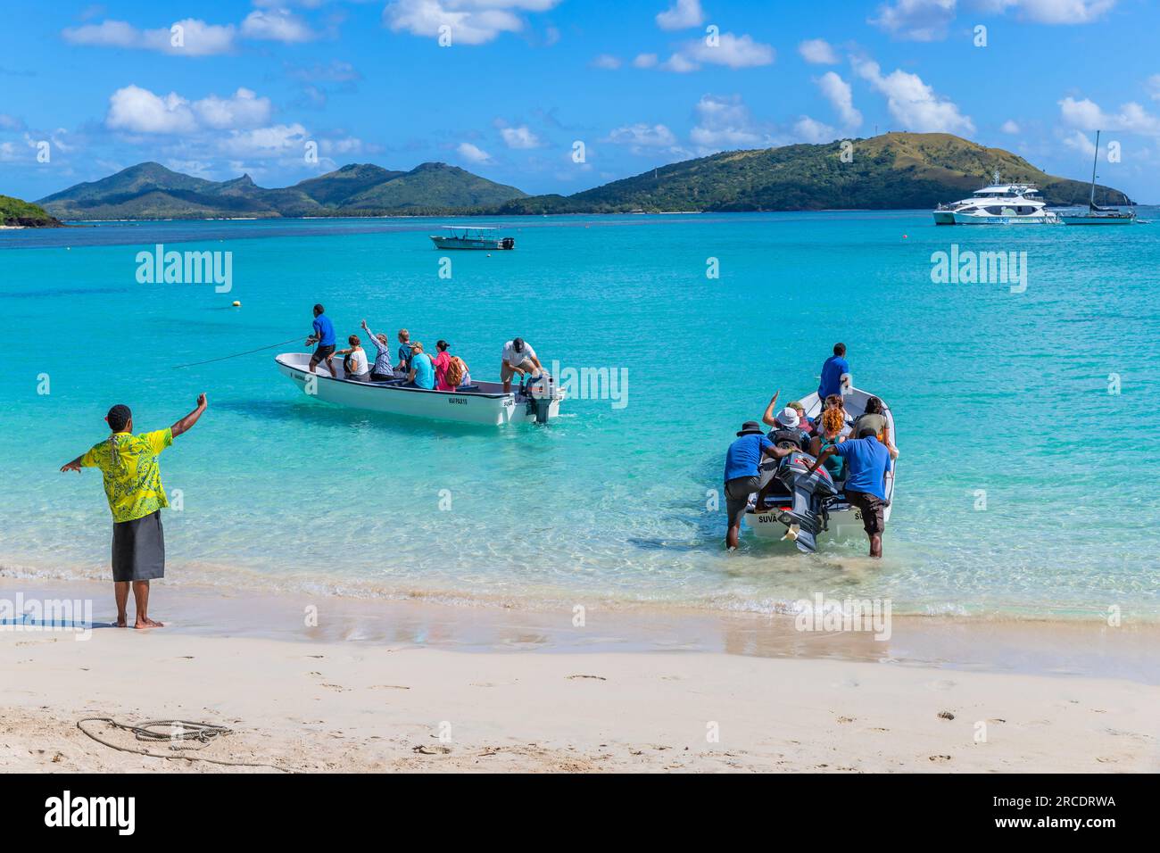 Nacula, Fiji: 26 May 2023: Tourists at the tropical sandy beach of ...