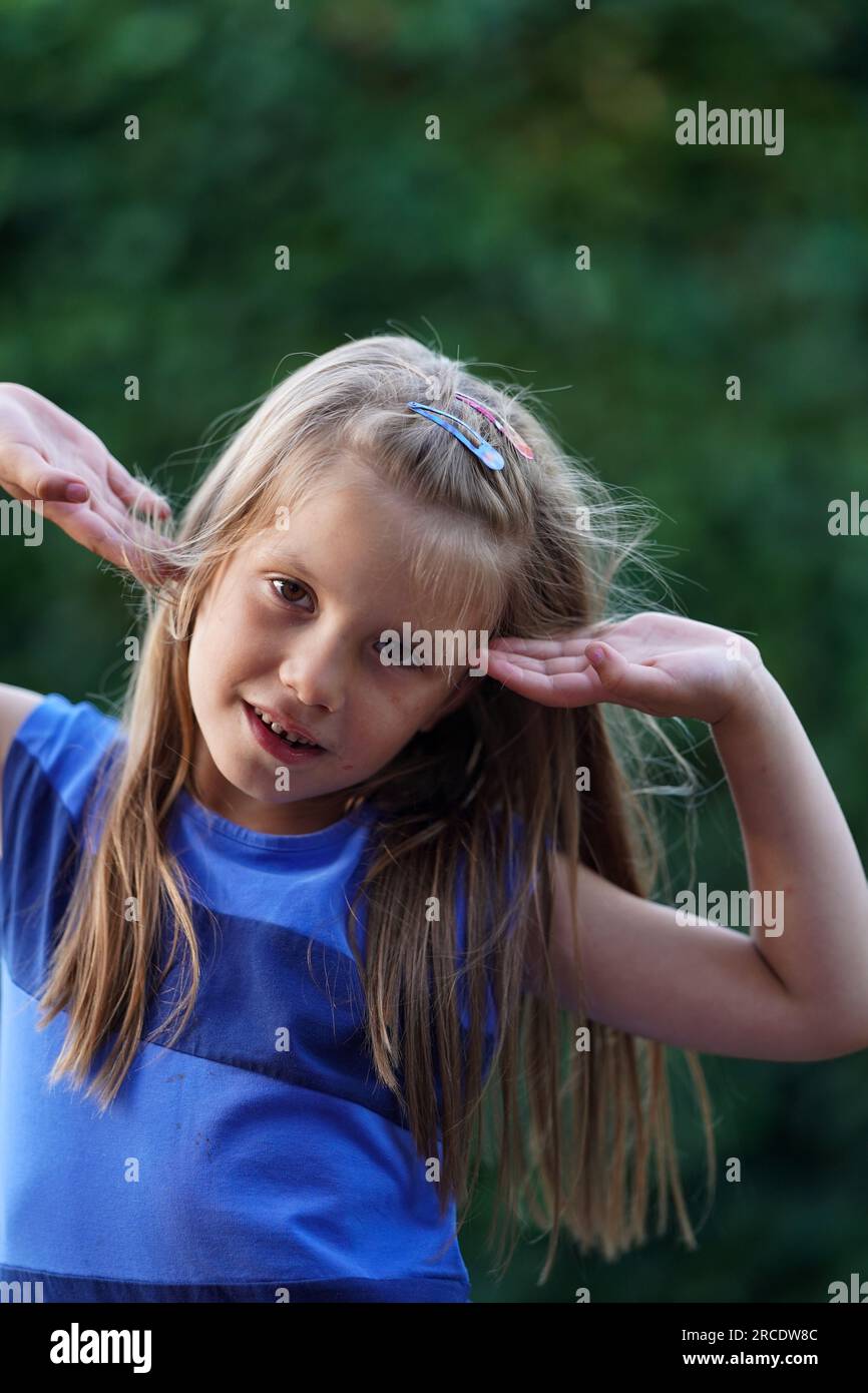 A cheerful girl with ruined teeth, the harm of candy for teeth ...