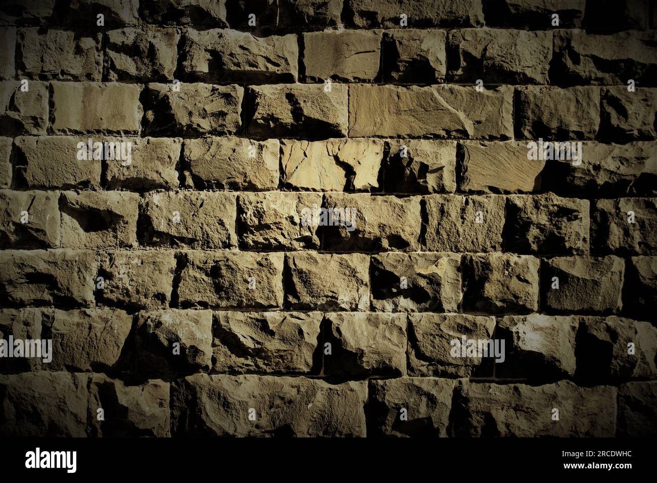 Black and white image. Old rough stone block wall Stock Photo - Alamy
