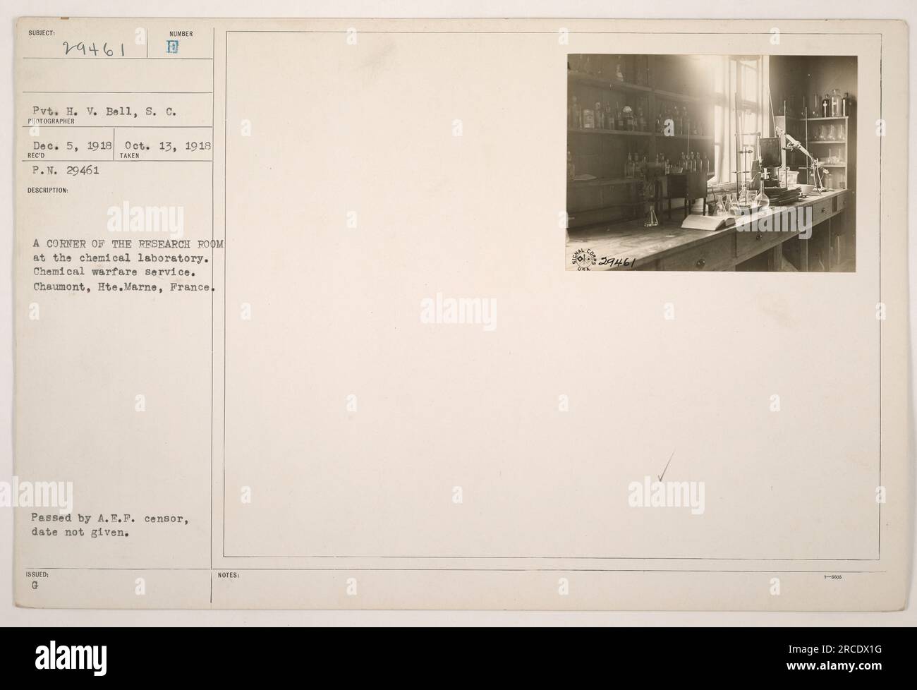 A photograph of Pvt. H. V. Bell at the chemical laboratory in Chaumont ...