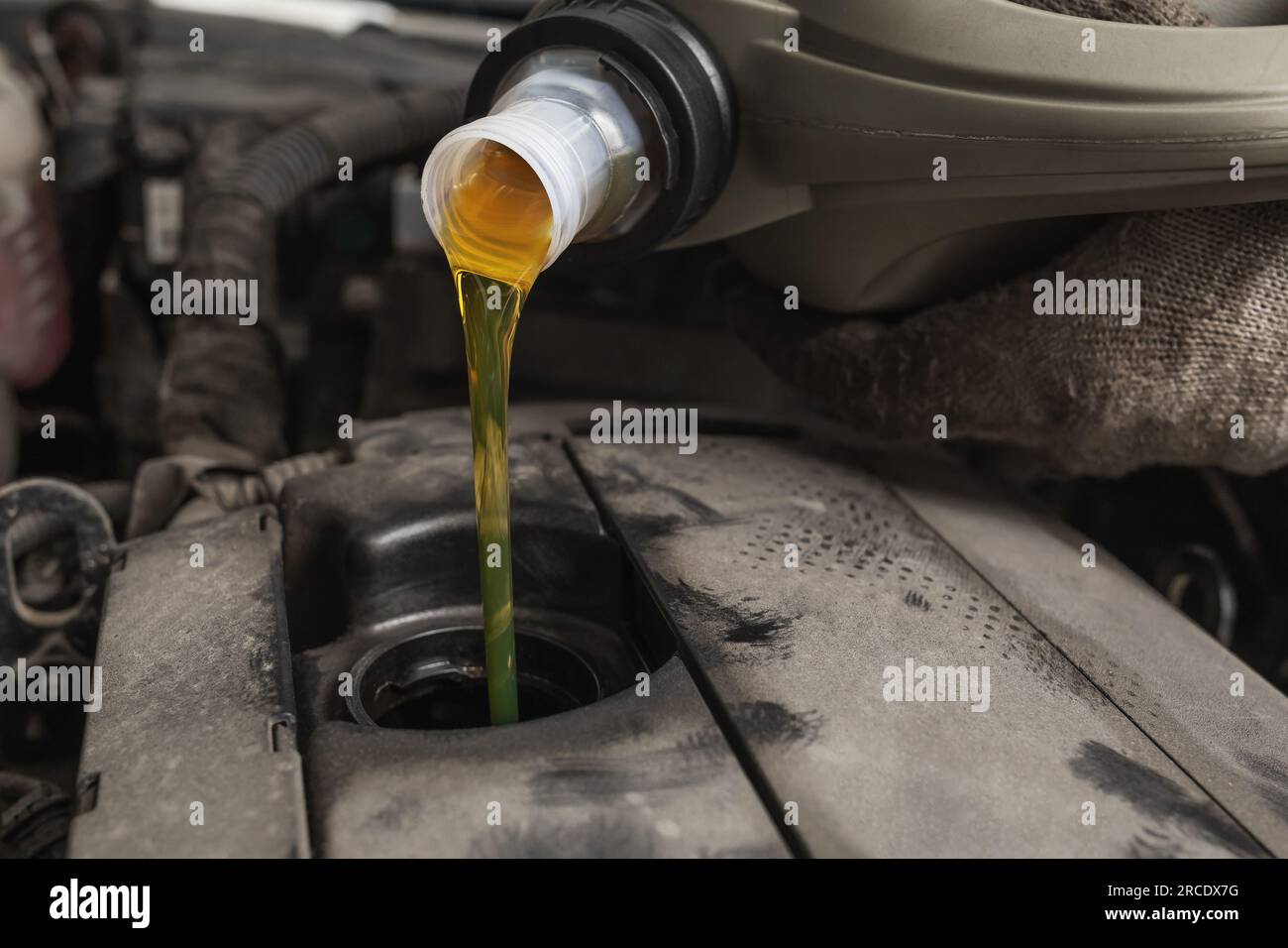 The process of filling the engine oil of a gasoline engine Stock Photo ...
