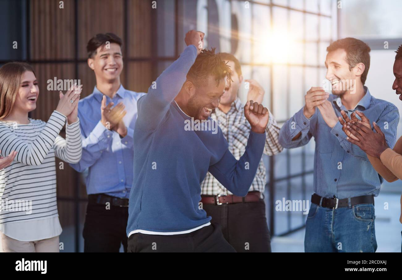 happy multiracial colleagues coworkers celebrate business success ...