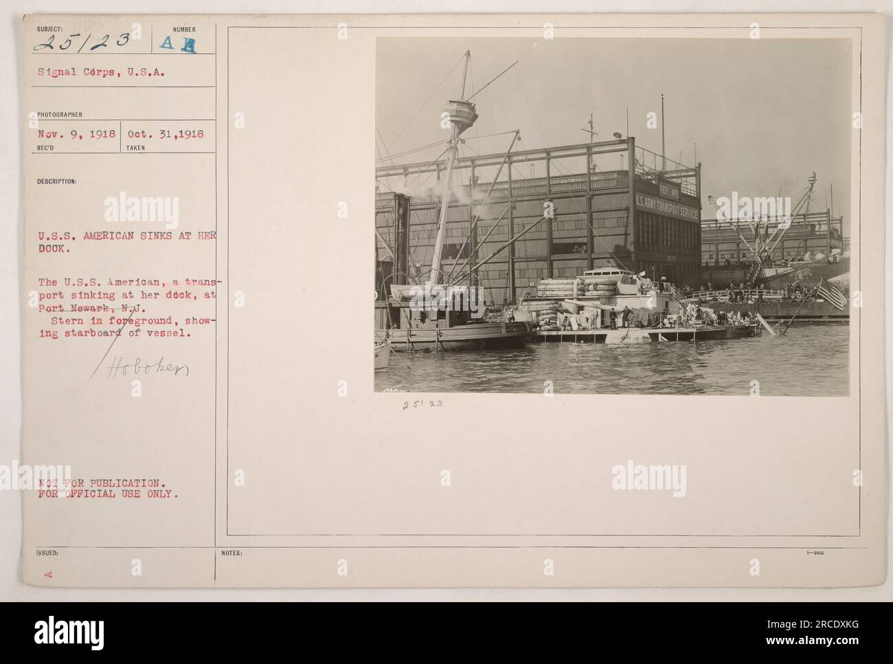 The U.S.S. American, a transport ship, sinking at its dock at Port ...