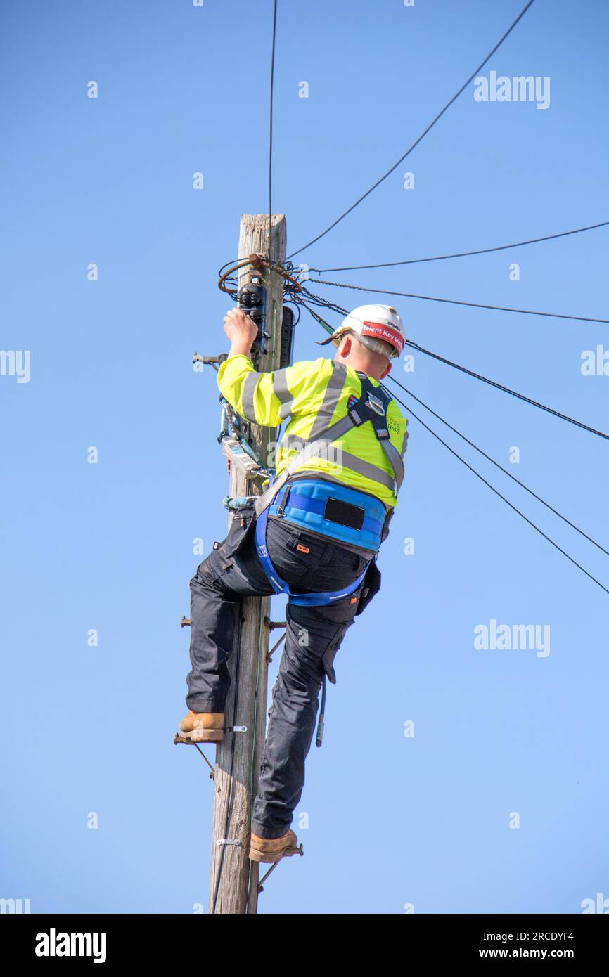 Openreach engineer on a telegraph pole, England, UK Stock Photo - Alamy