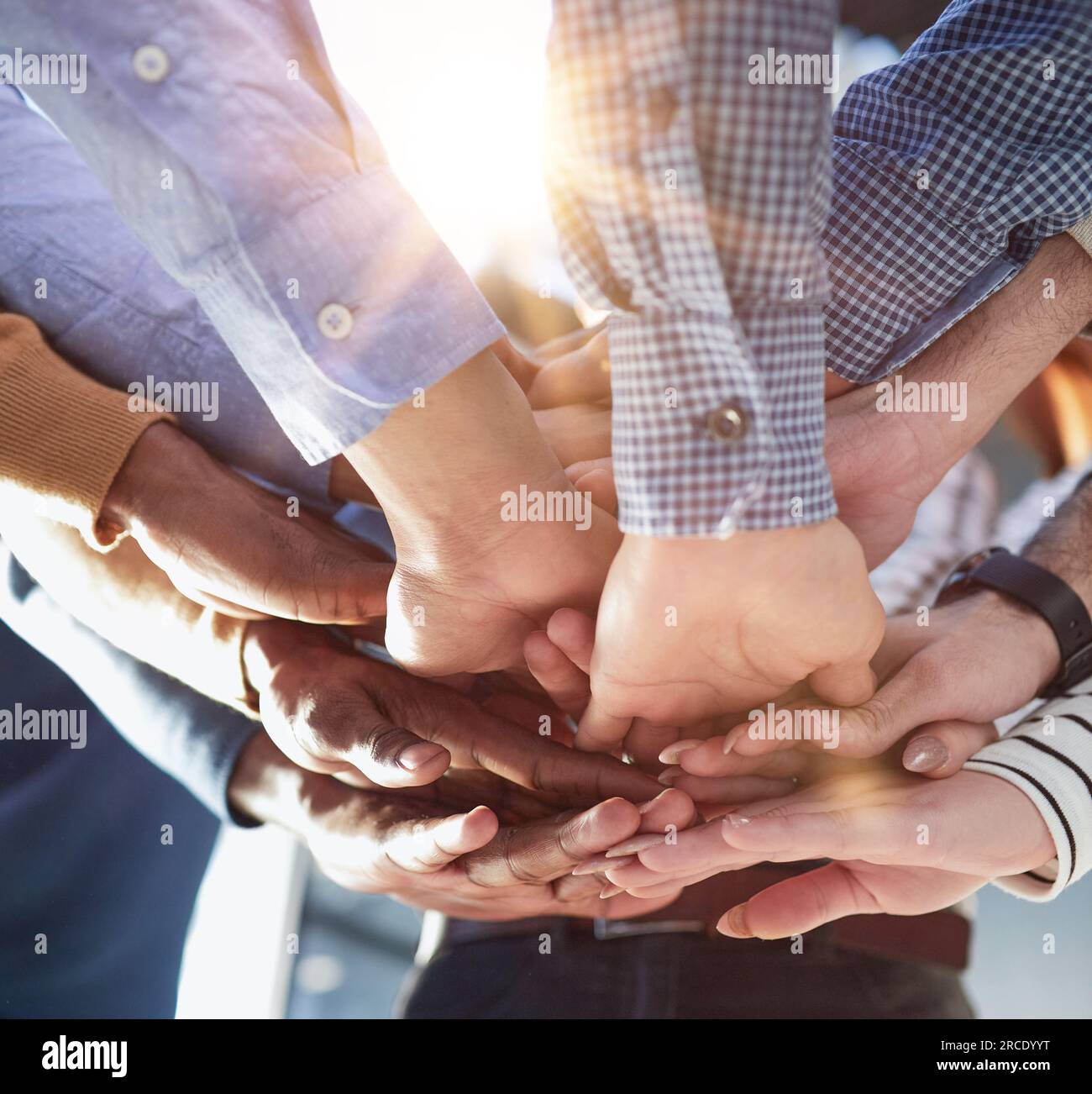 young business people putting their hands together. Stack of hands. Unity and teamwork concept ...