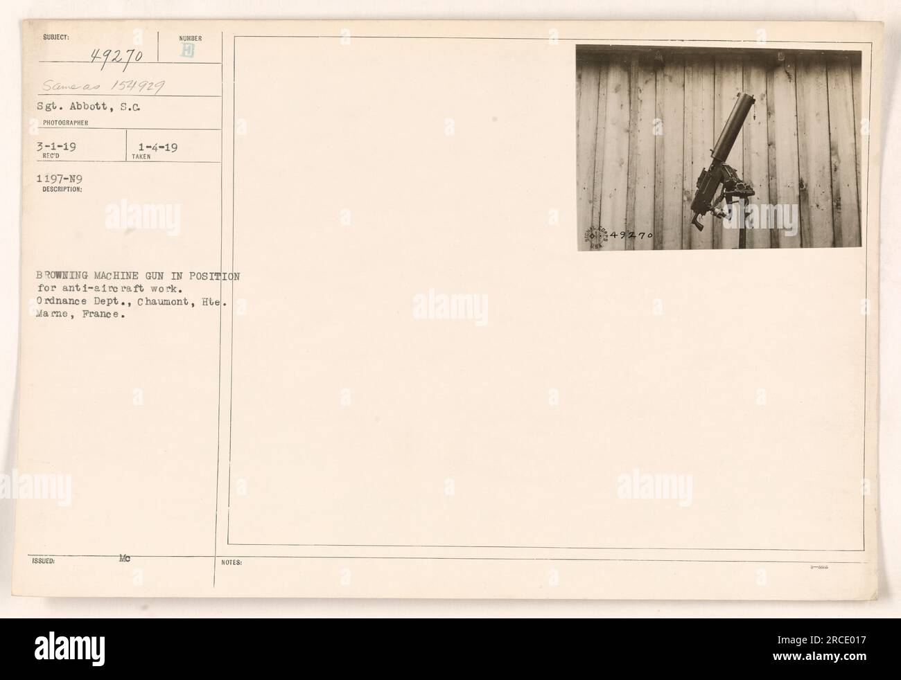 A Browning machine gun is seen in position for anti-aircraft work at ...