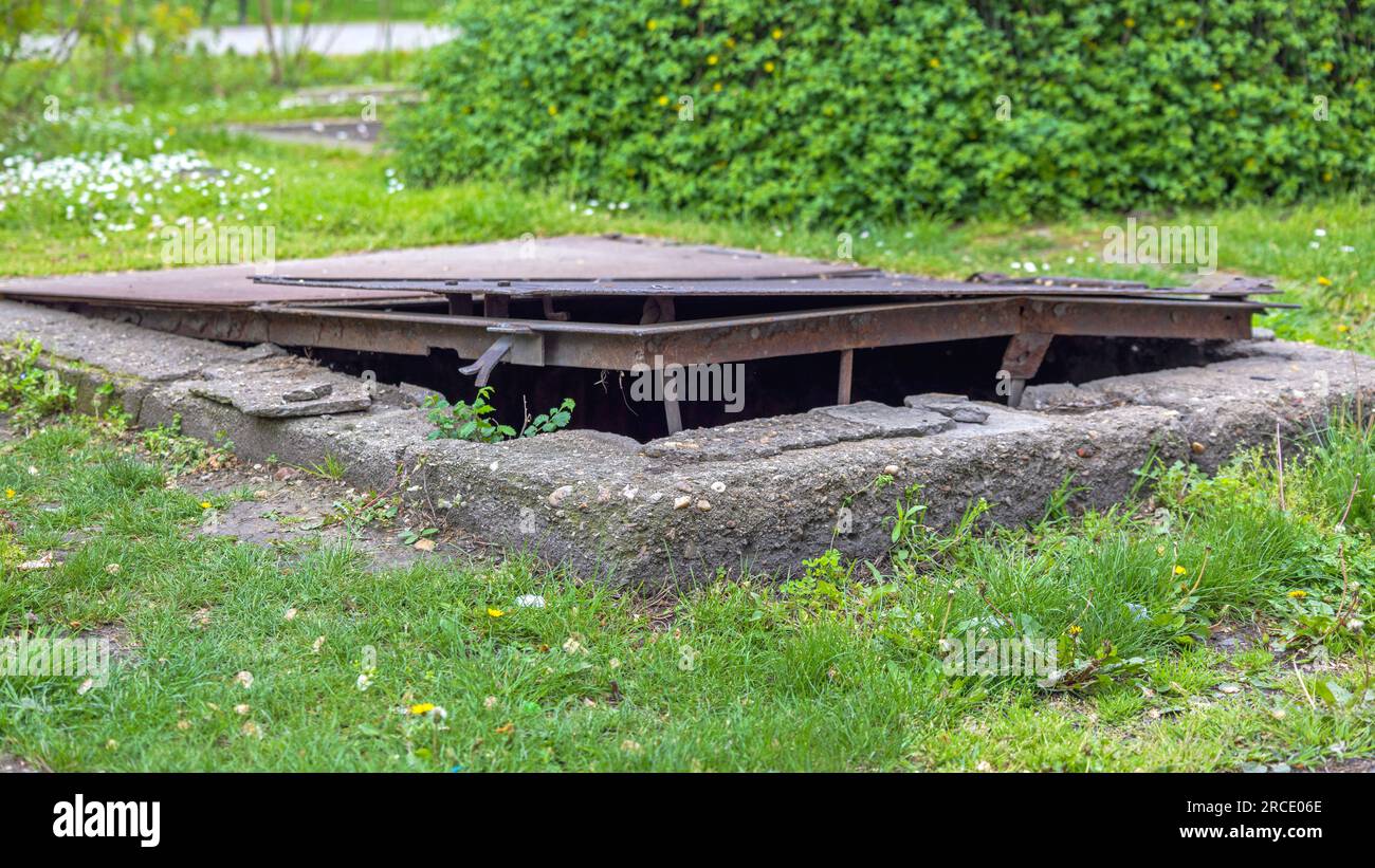 Damaged Cover Utility Shaft Open Danger in City Park Stock Photo - Alamy