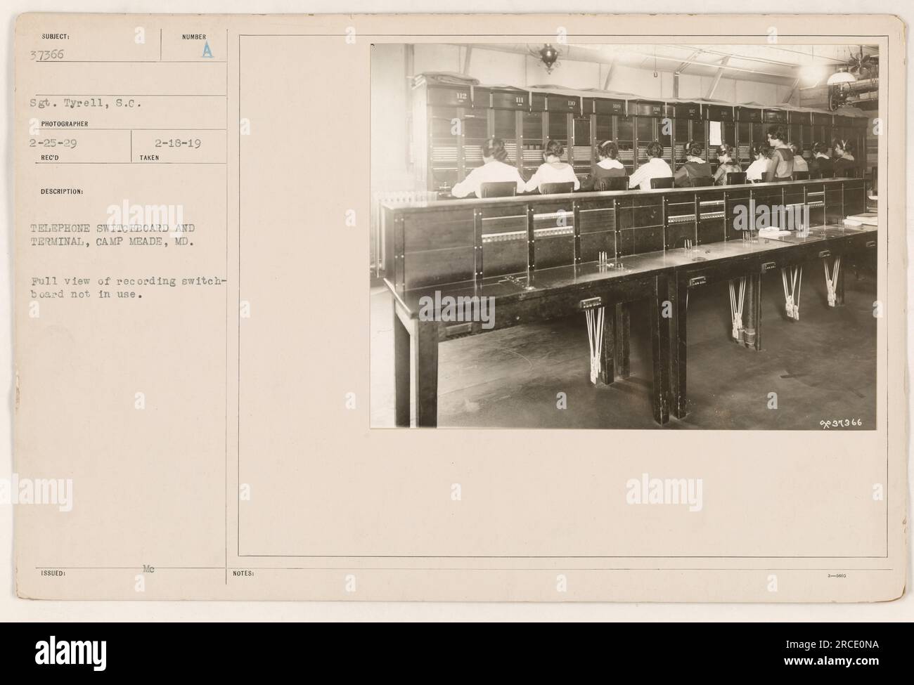 A photograph showing a full view of a telephone switchboard and ...