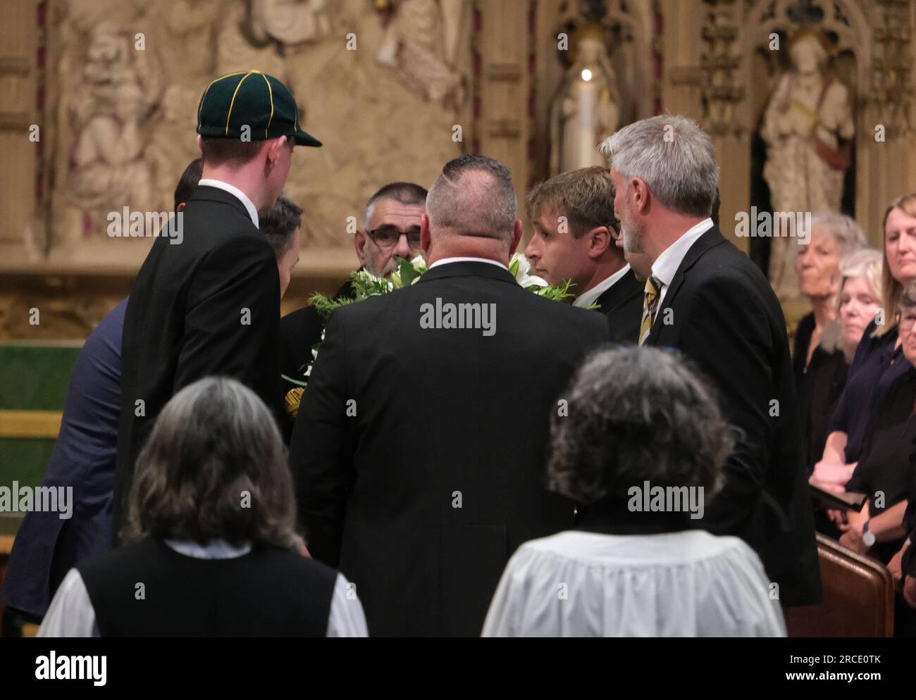 The coffin of Barnaby Webber is carried by friends and family ...