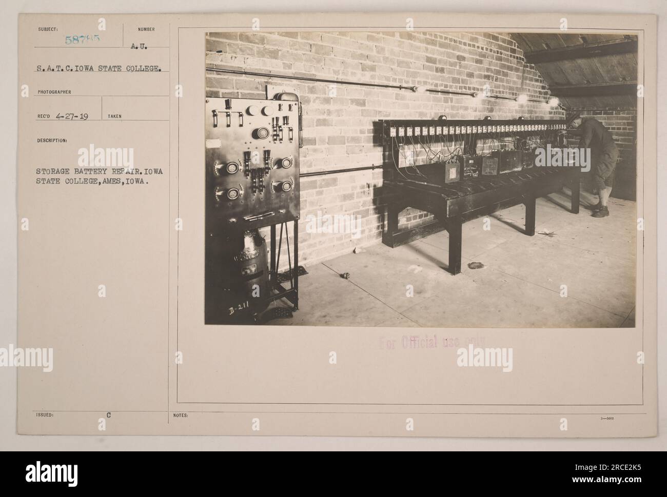 Soldiers at Iowa State College repair a storage battery as part of ...