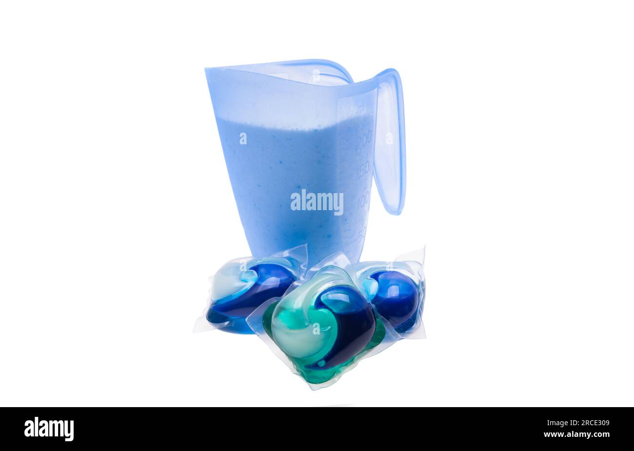 washing powder in measuring cup isolated on white background Stock ...