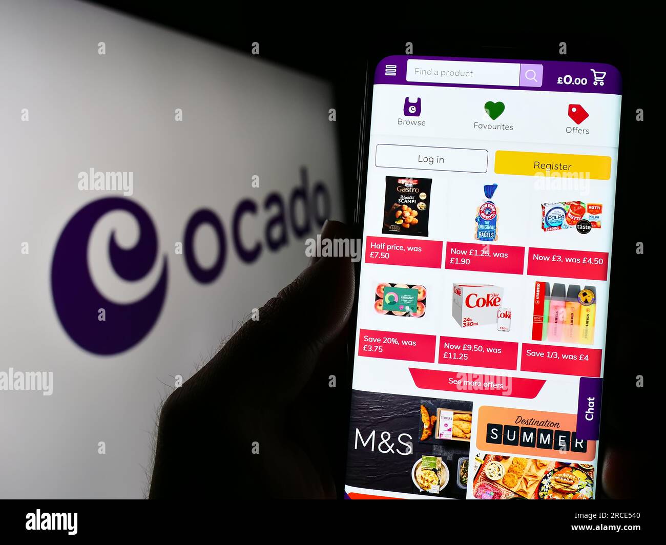 Person holding smartphone with web page of British e-commerce company Ocado Retail Limited on ...