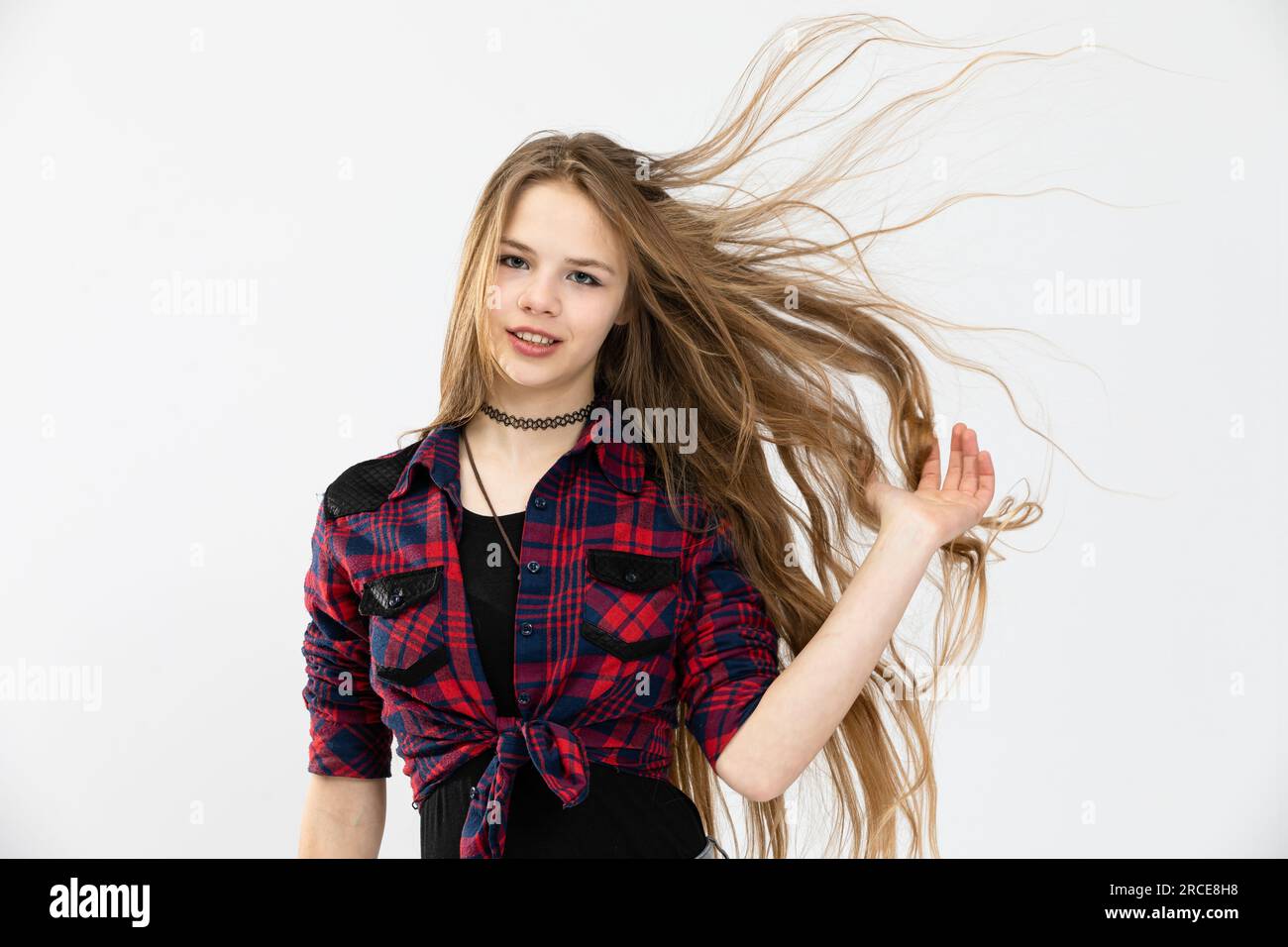 Young girl's long hair flies in the air in the wind Stock Photo - Alamy