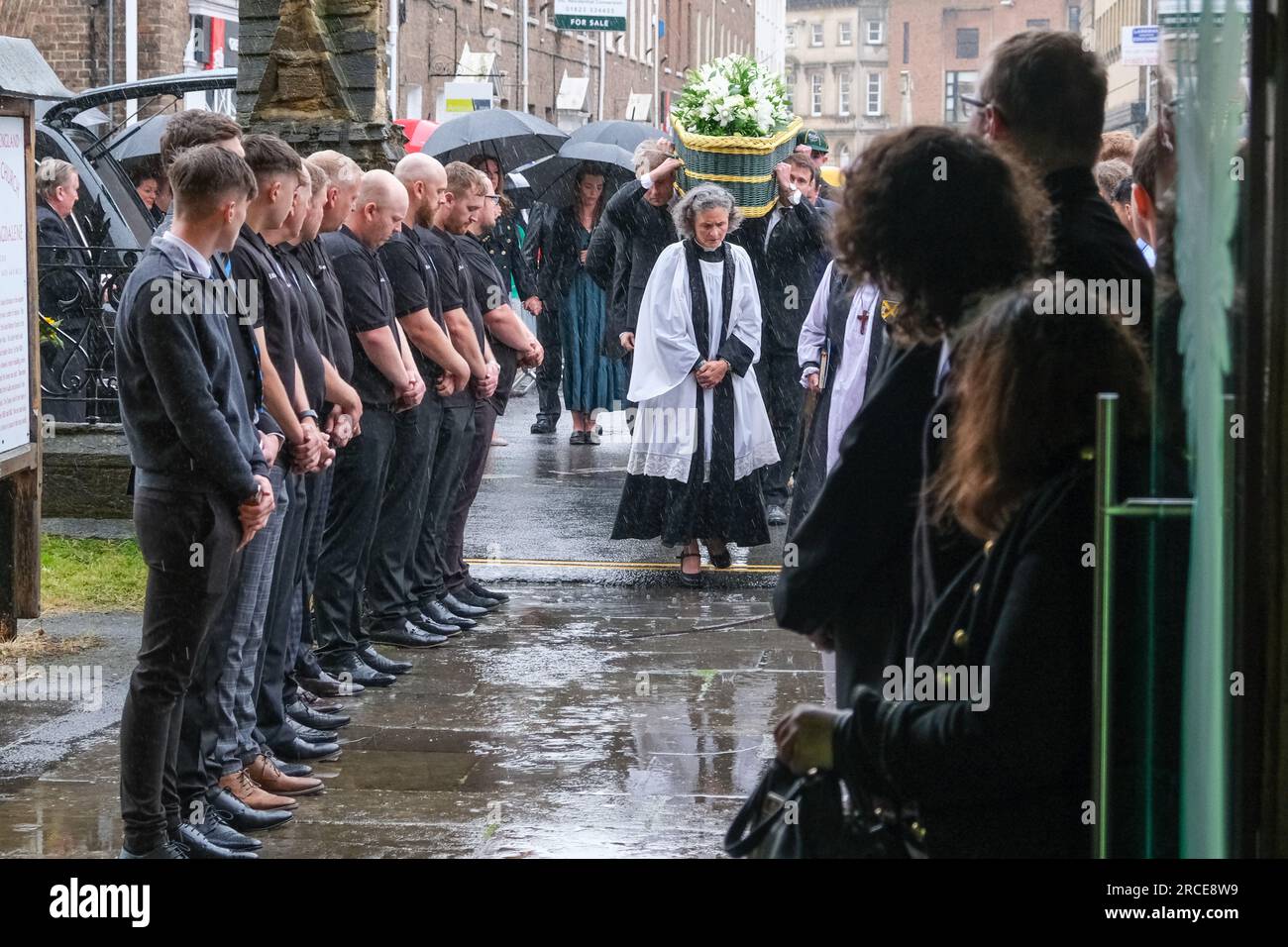 The coffin of Barnaby Webber is carried into Taunton Minster in Taunton ...