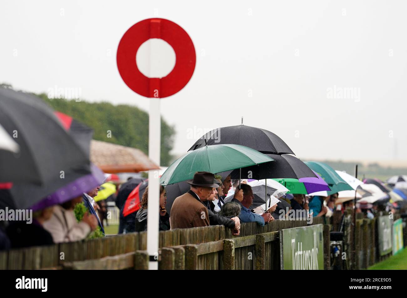 Racegoers in the rain during Festival Friday of The Boodles July ...