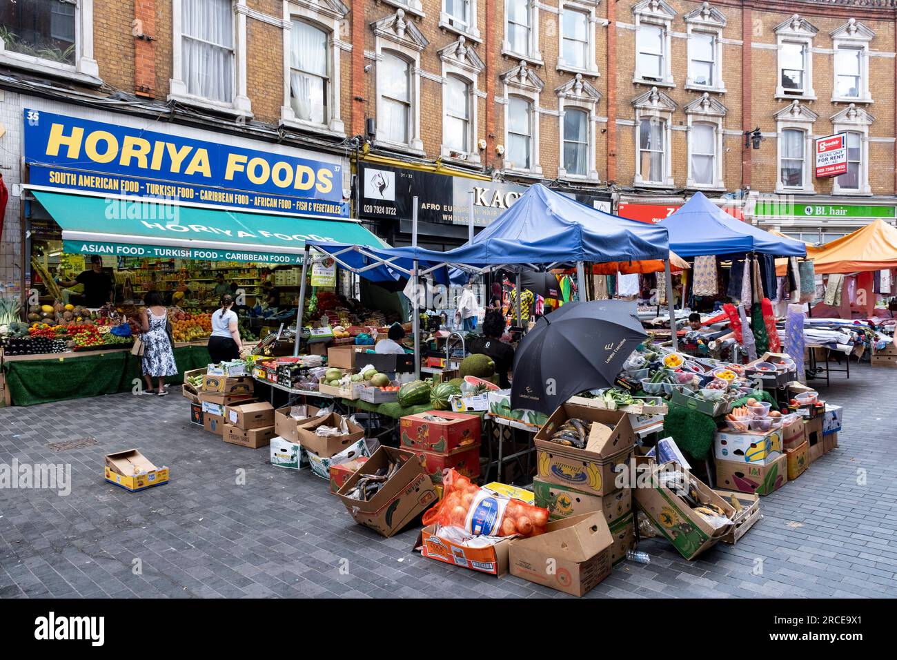 The vibrant Brixton Market on Electric Avenue in the diverse community ...