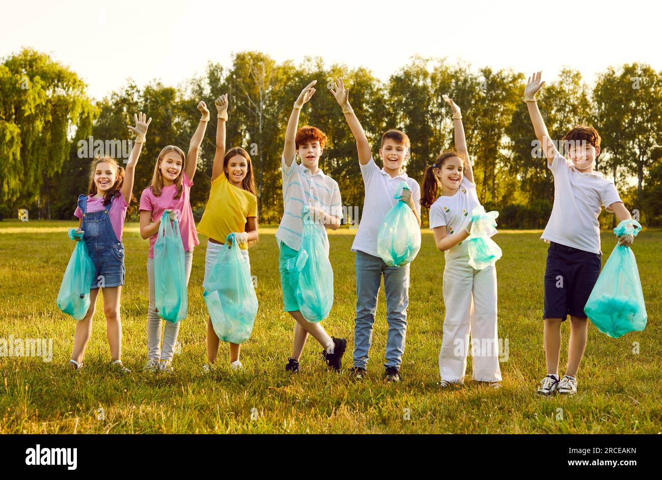 Group of cheerful and active volunteer children gathered together to ...