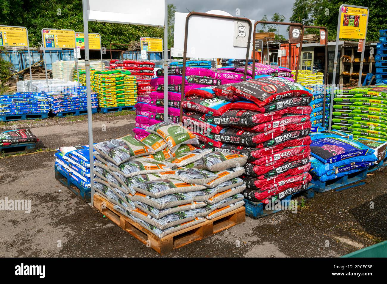 Bags of bark, gravel, and compost on sale in garden centre, UK Stock ...