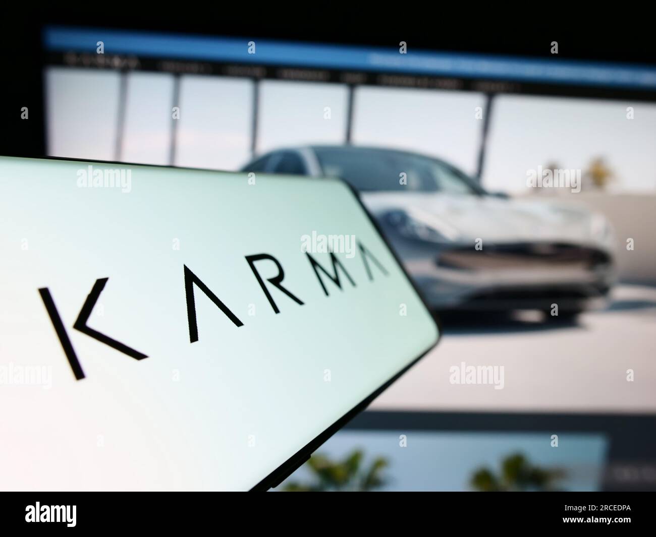 Smartphone with logo of electric vehicle company Karma Automotive LLC ...