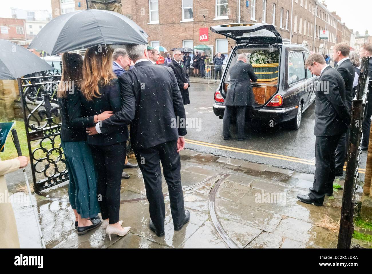 The coffin of Barnaby Webber is carried from at Taunton Minster in ...