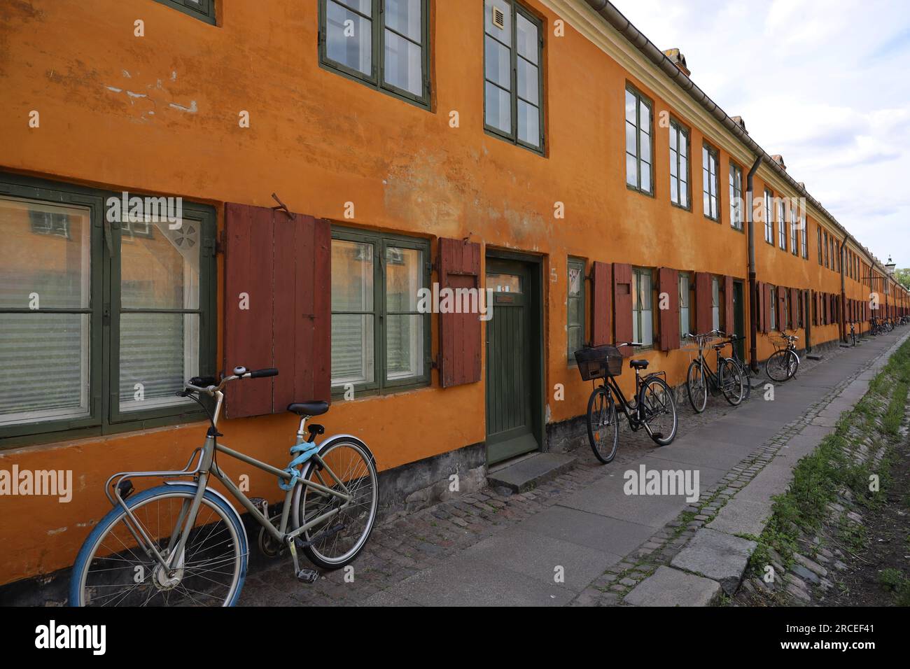 Characteristic yellow terraced houses in the historic district of ...