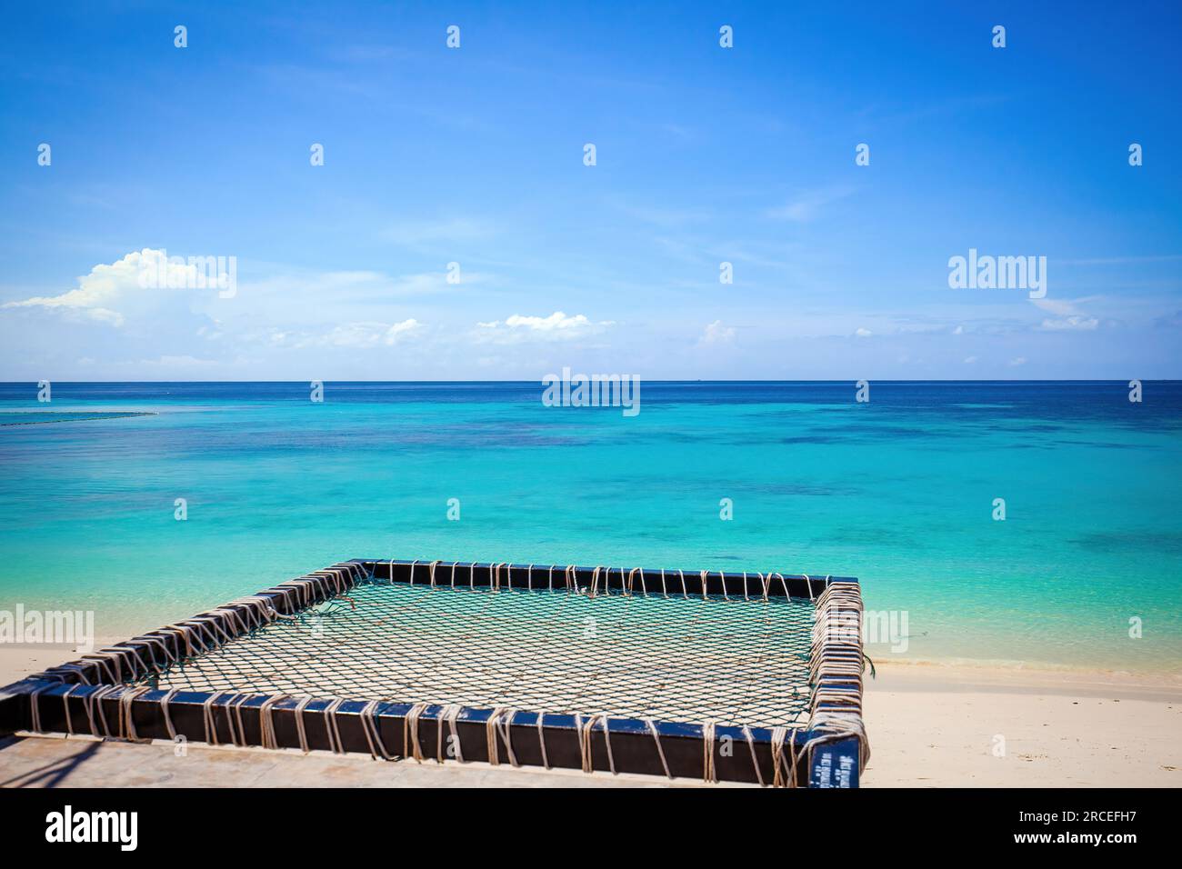 Tropical beach with turquoise water and photo spot with hammock Stock ...