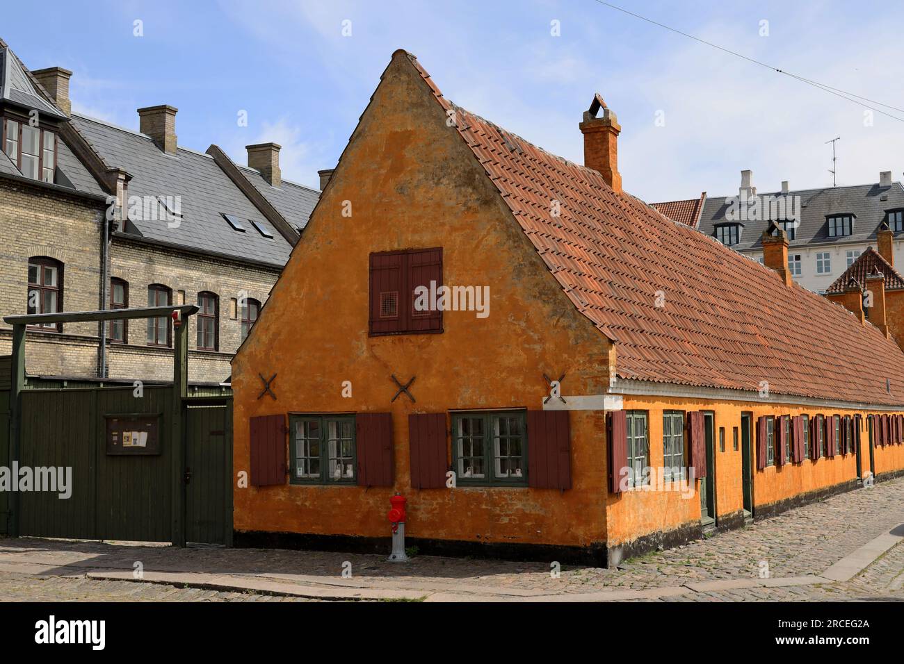 Characteristic yellow terraced houses in the historic district of Nyboder in Copenhagen Stock ...