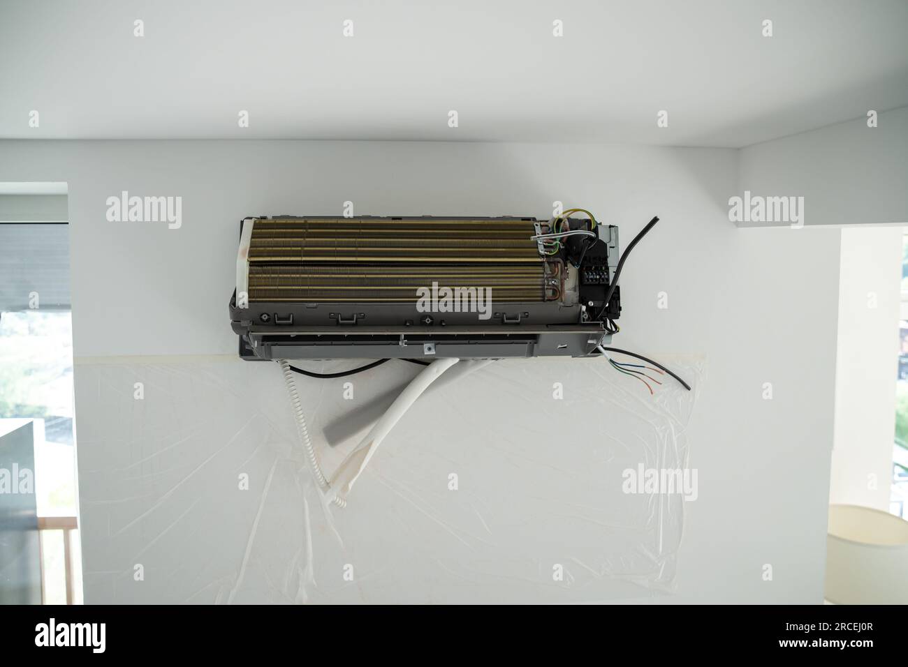 Installation air conditioning system in room with white wall in ...