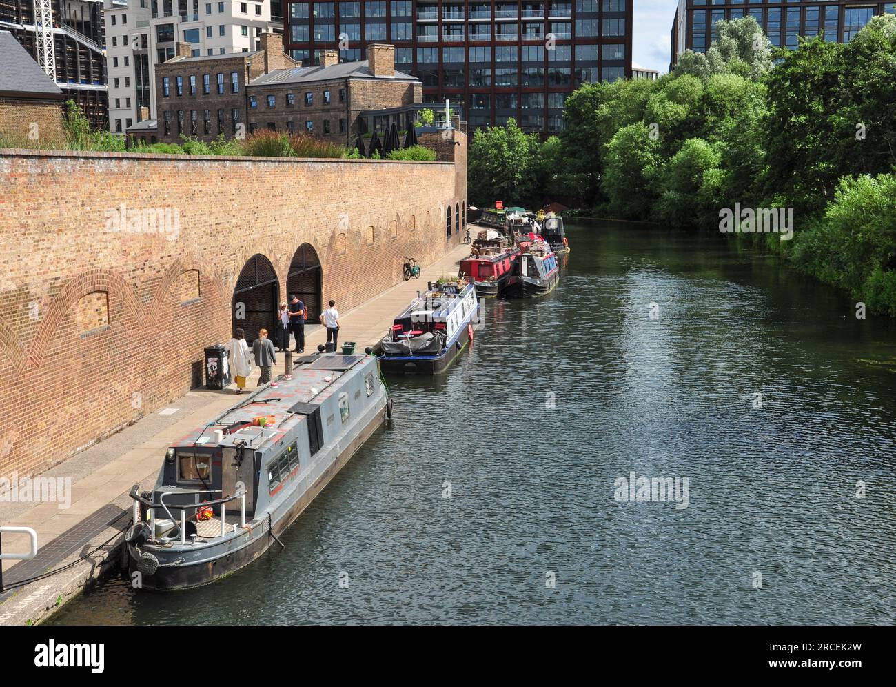 Moored narrow boats by the old coal drops on the Regent's Canal at King ...