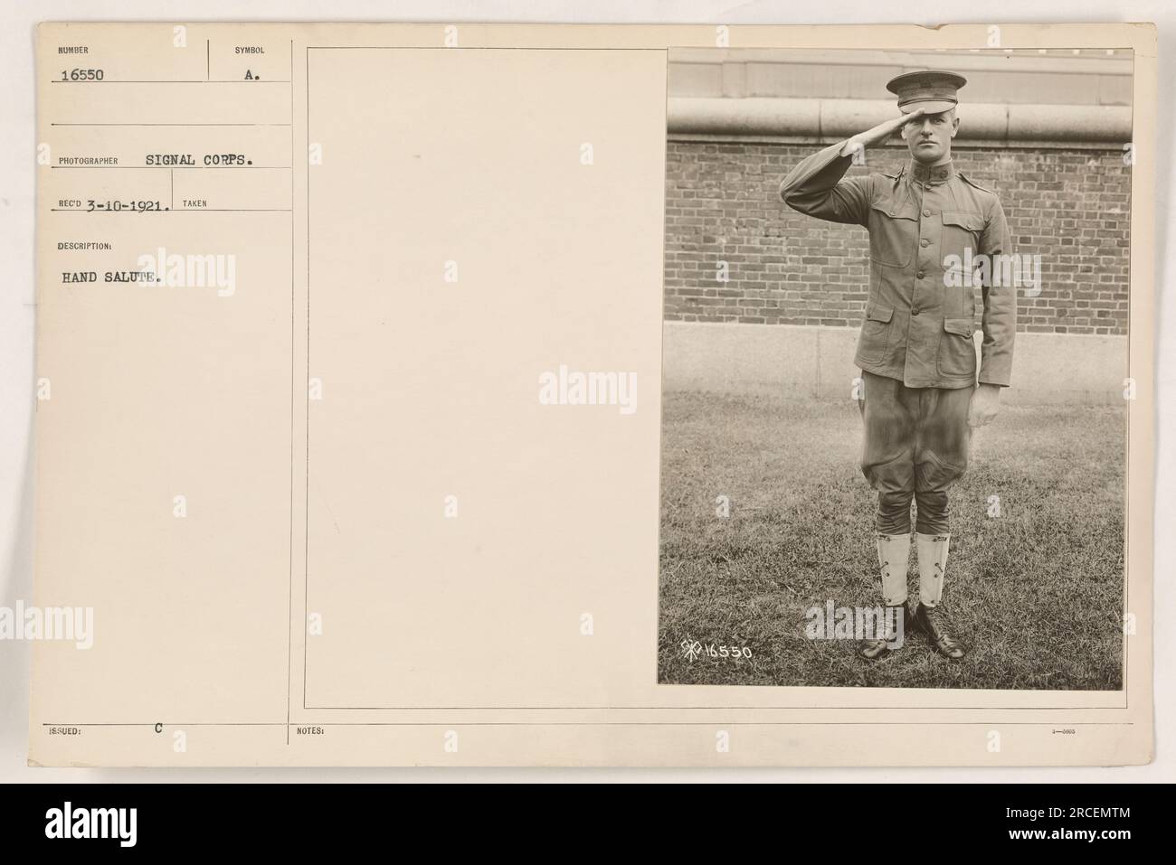 Soldier salutes the photographer in a hand salute. The photograph was ...