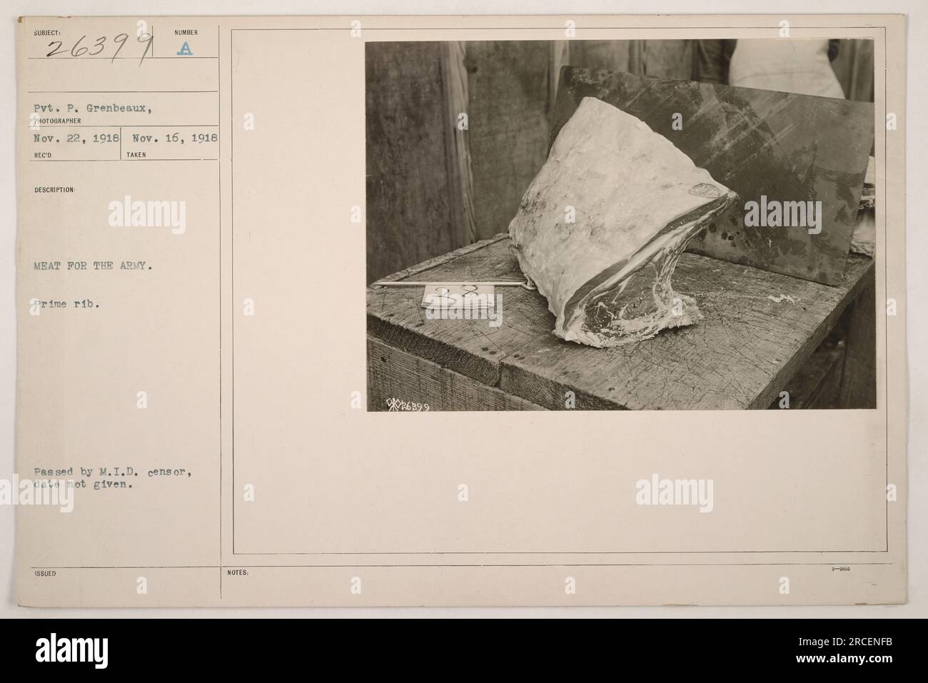 Soldier looking at prime rib meat being prepared for the Army during ...