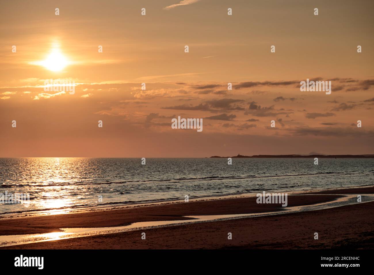 Sunset over the Irish Sea at Dinas Dinlle on the North Wales coast ...
