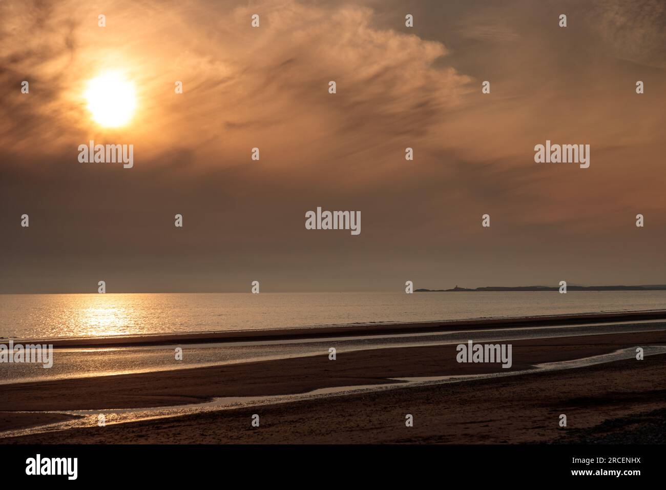 Sunset over the Irish Sea at Dinas Dinlle on the North Wales coast ...