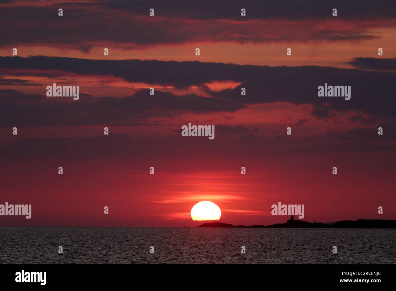 Sunset over the Irish Sea at Dinas Dinlle on the North Wales coast ...