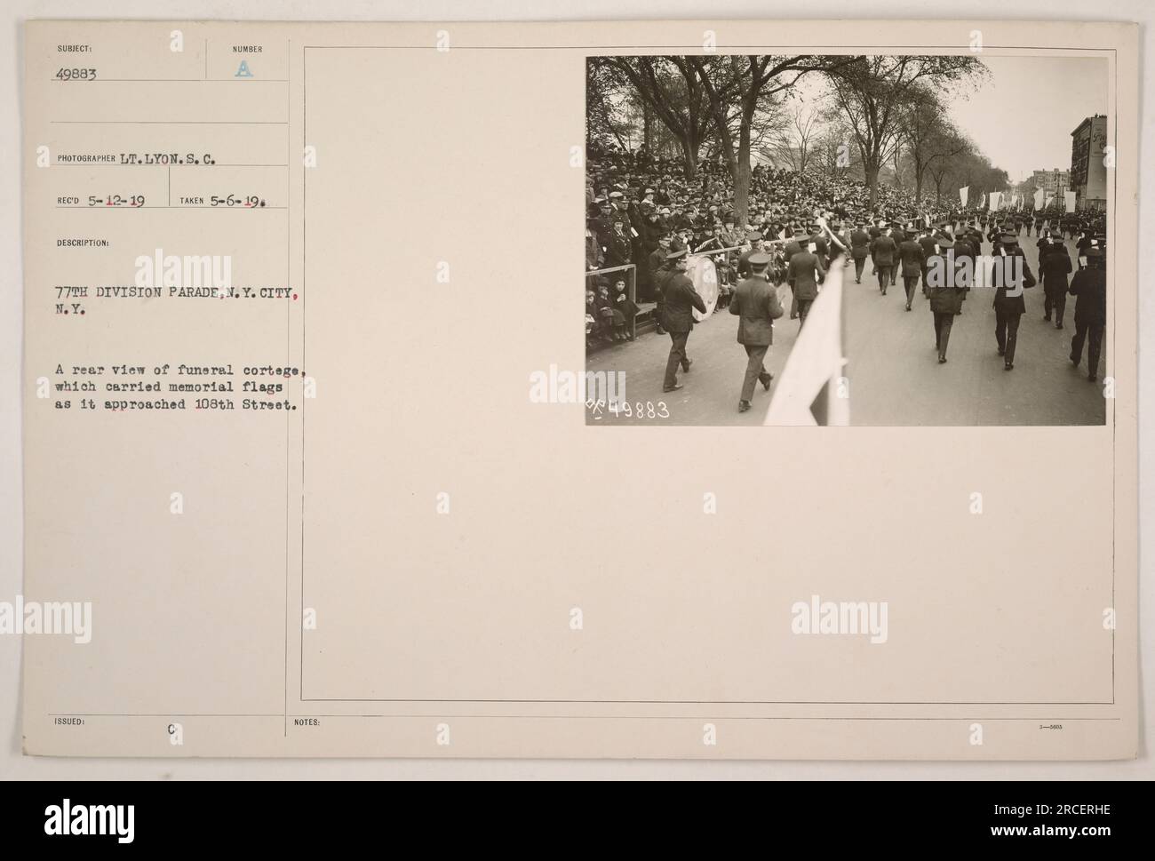 The image shows the rear view of a funeral cortege during the 77th ...