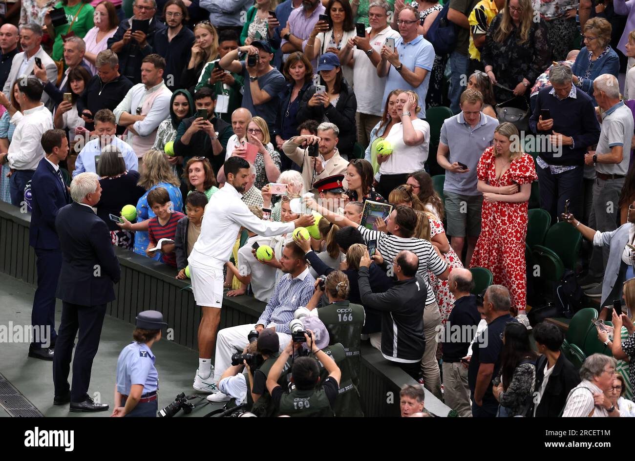 Novak Djokovic signs autographs for fans following his victory in the ...