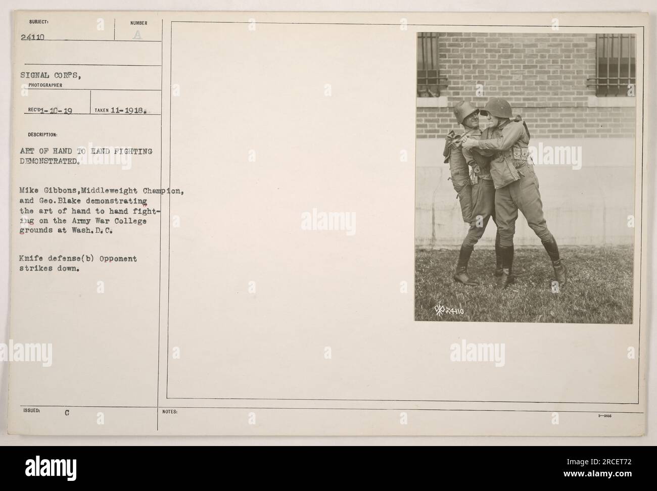 Mike Gibbons and Geo. Blake demonstrate hand-to-hand combat techniques ...