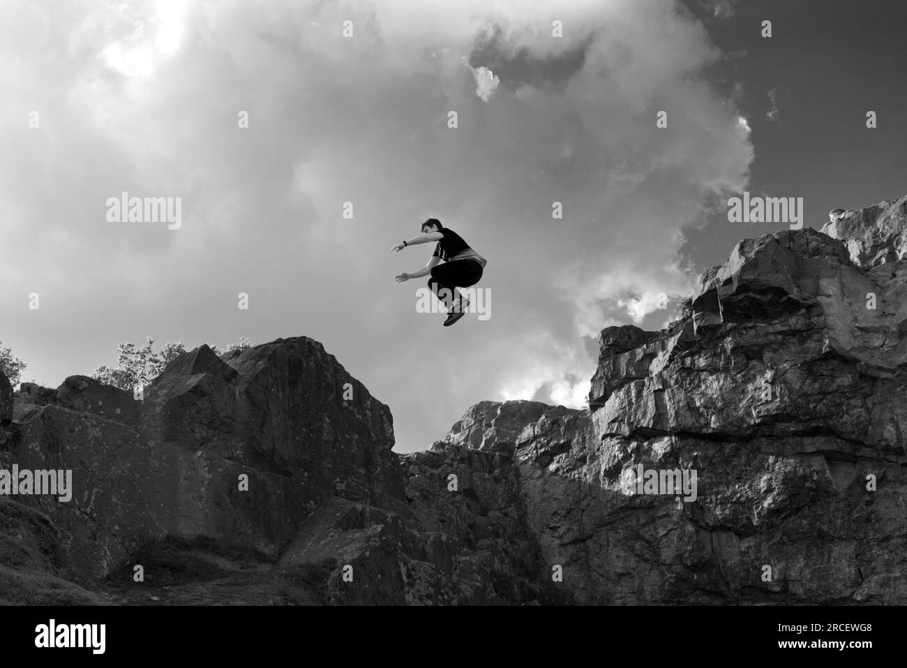 Person captured floating mid-air while completing a parkour move in ...