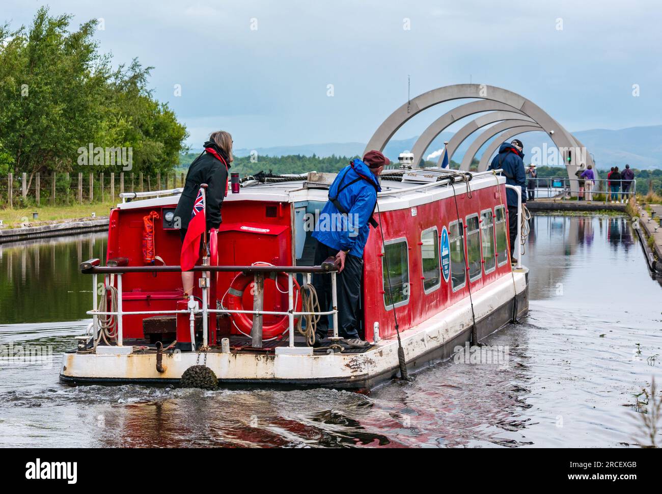 Canal boat or barge approaching Falkirk Wheel on Union Canal Scotland ...
