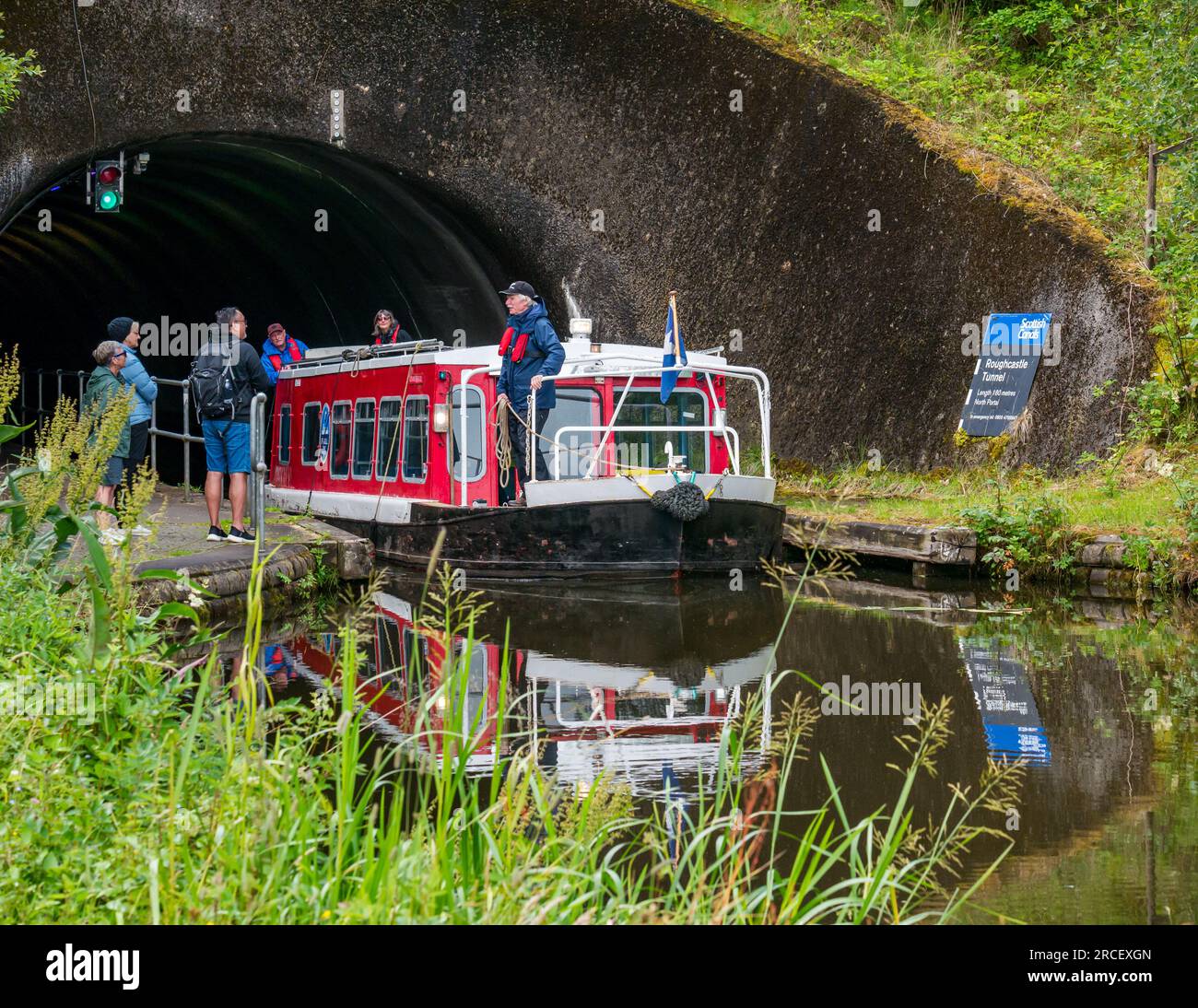 Canal boat or barge exiting Roughcastle tunnel on Union Canal, Scotland ...