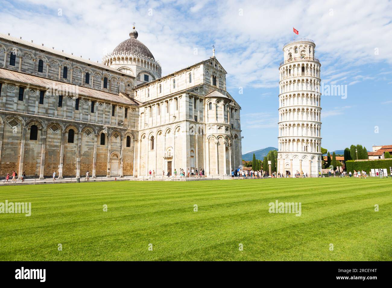 Pisa, Italy - 29 June 2023: Famous Leaning Tower landmark with blue sky ...