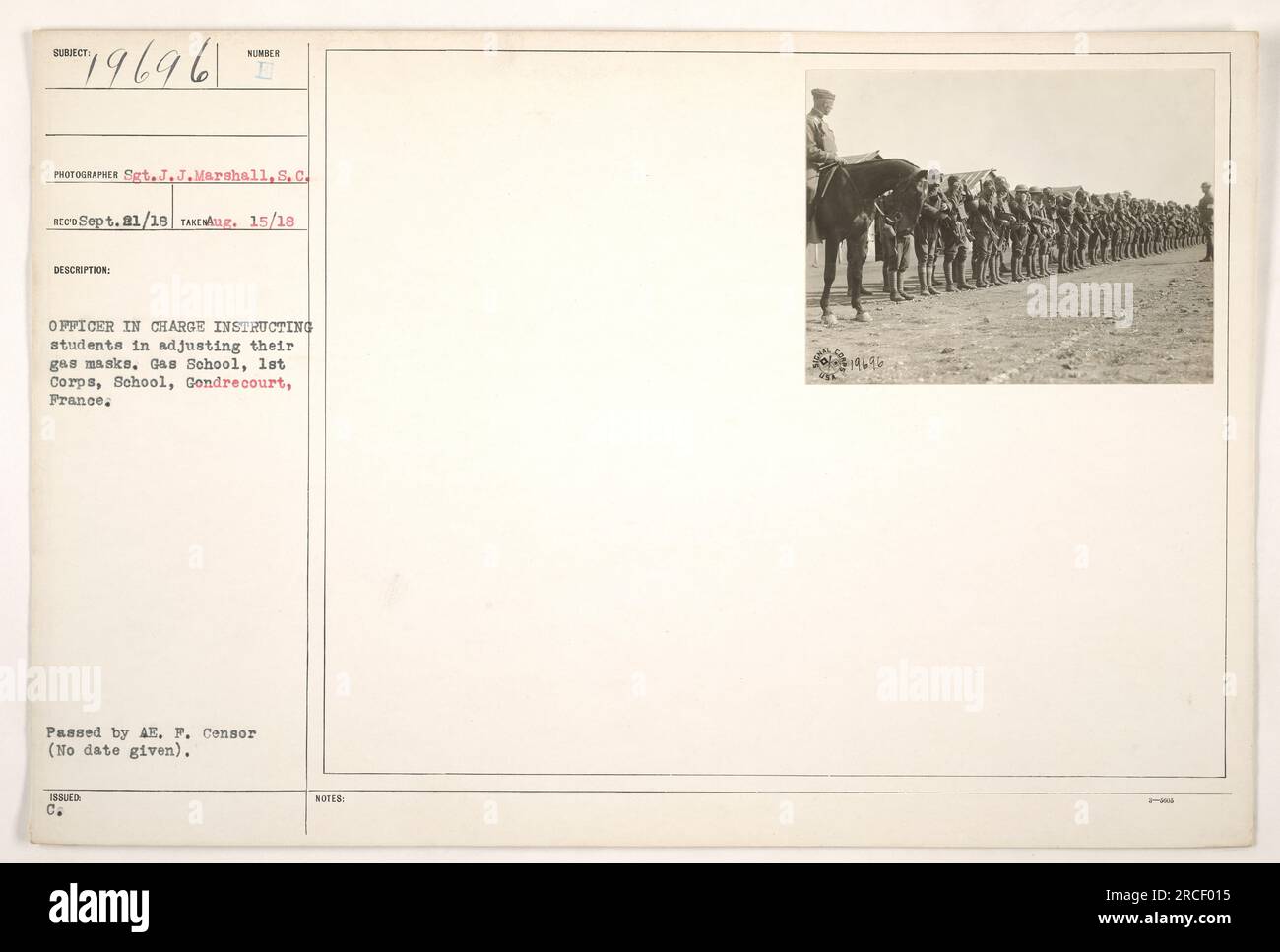 An American military officer instructs students on how to adjust their ...