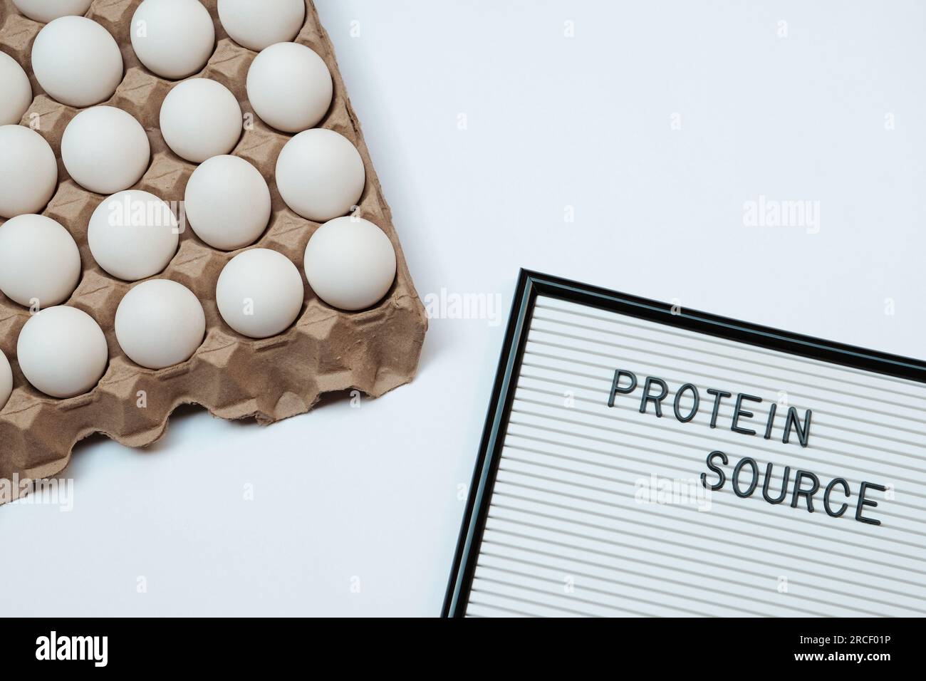 A Carton Of Fresh Eggs With 'Protein Source' Sign On A Whiteboard Stock ...