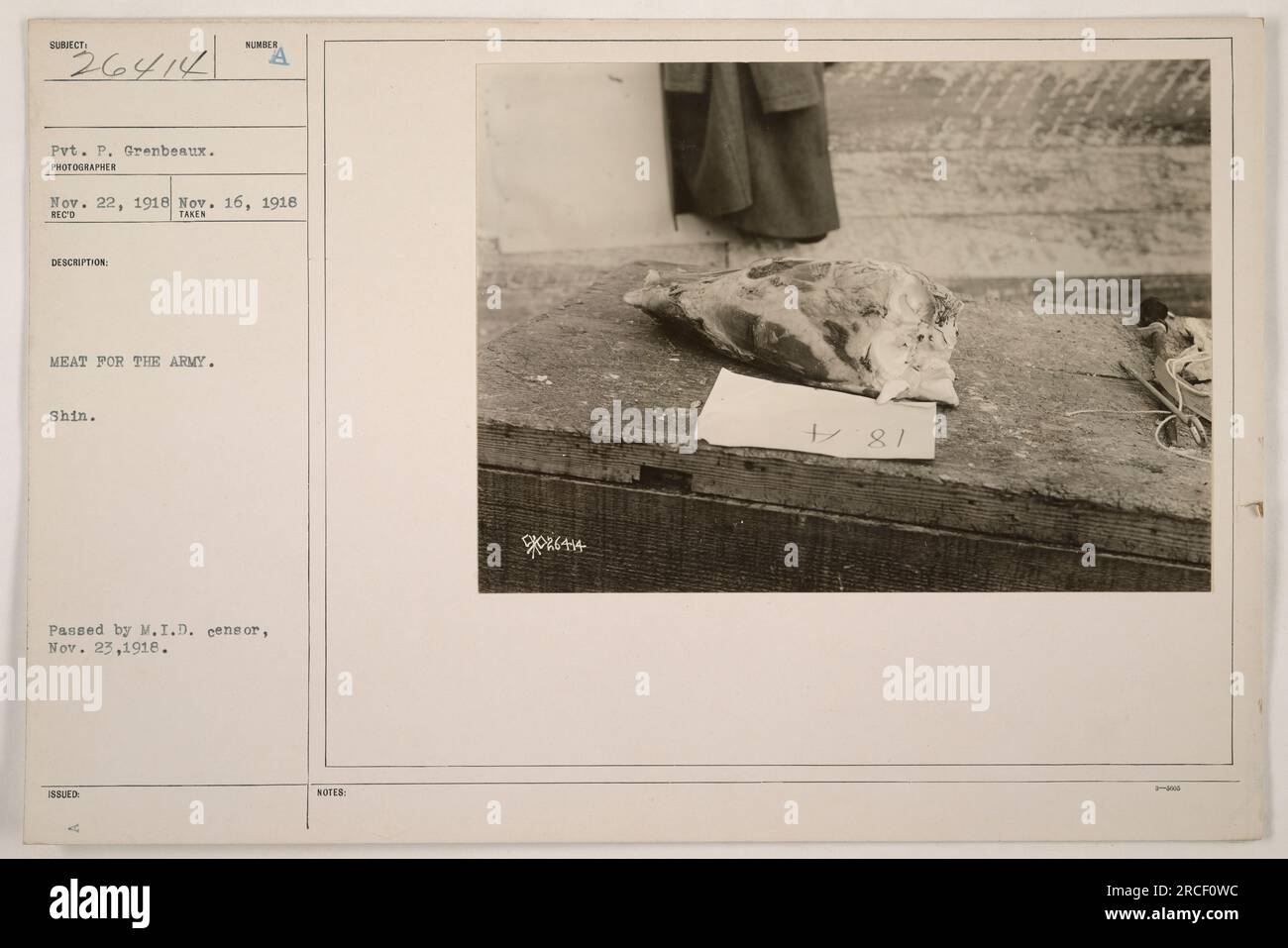 Soldier cooking meat for the army during World War One. This photograph ...