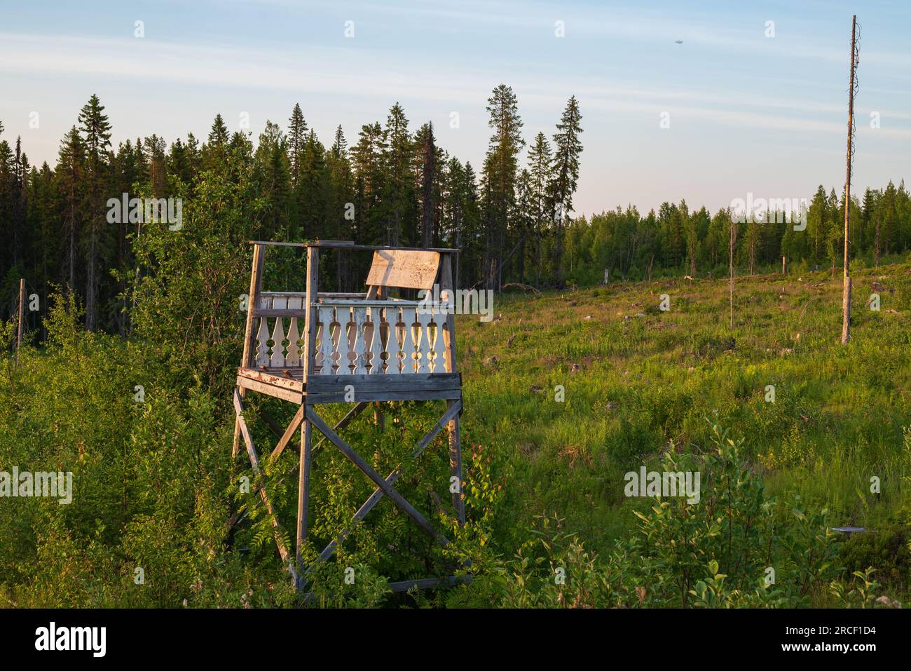 Hunting tower for moose hunting with a beautifully carved railing with ...