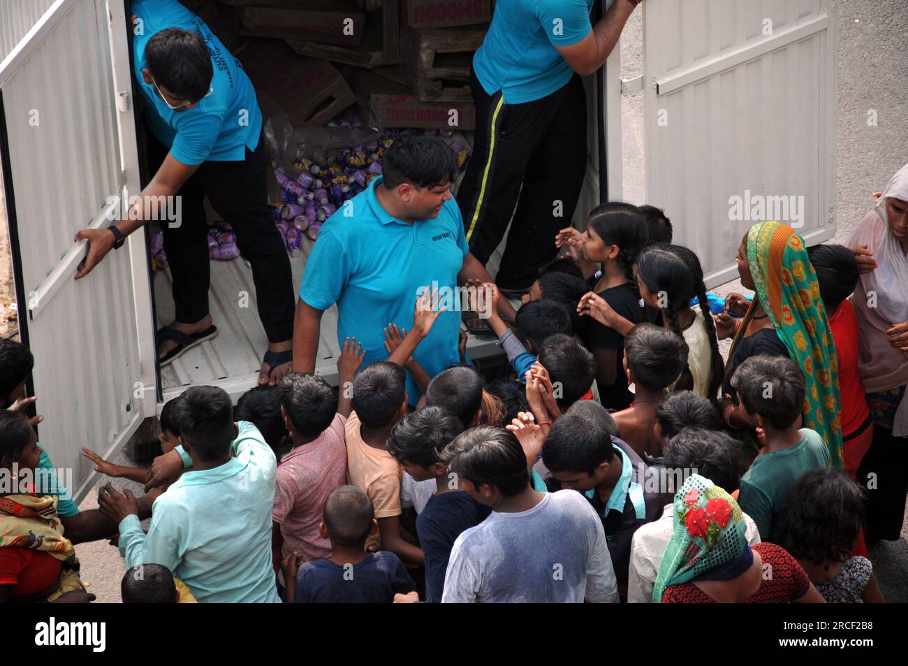 New Delhi, Delhi, India. 14th July, 2023. NGO Distributing Milk and ...