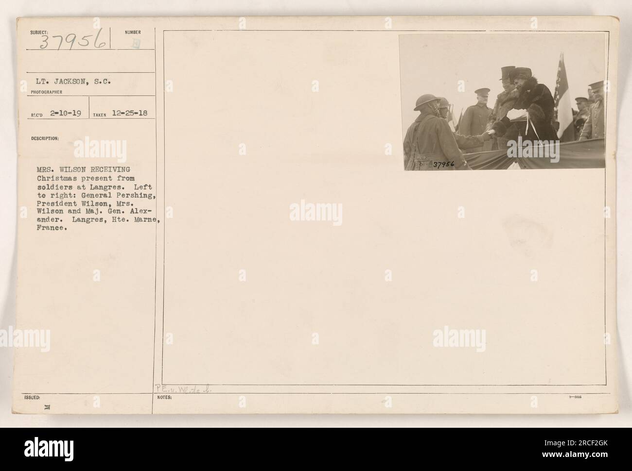 President Wilson, accompanied by General Pershing, presents a Christmas ...