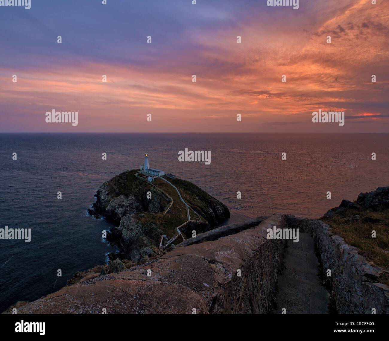 The head of the 400 steps down to South Stack Lighthouse at sunset ...
