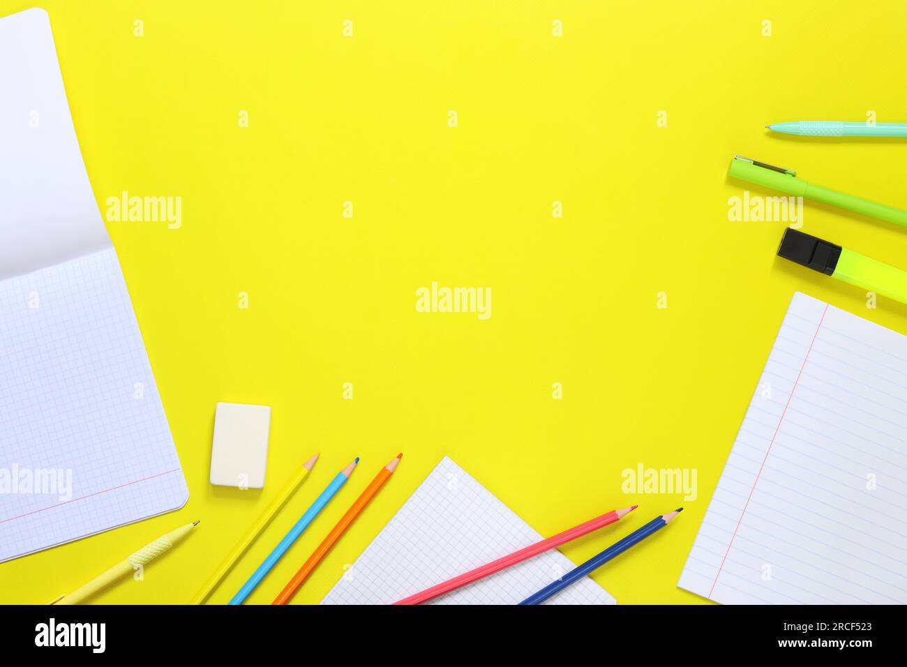 Back to school. Workspace, top view, flat lay. Open notebooks, pencils ...